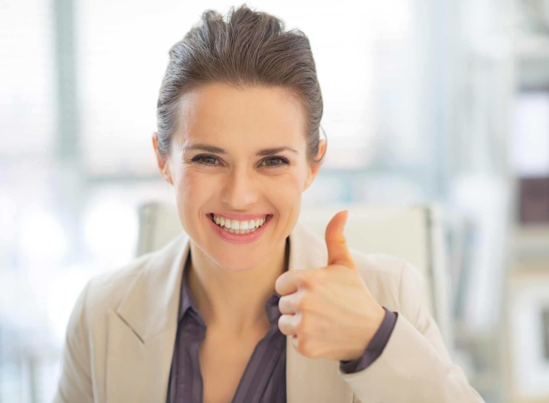 Portrait of happy business woman showing thumbs up | Your Search Staff Portrait of happy business woman showing thumbs up | Your Search Staff